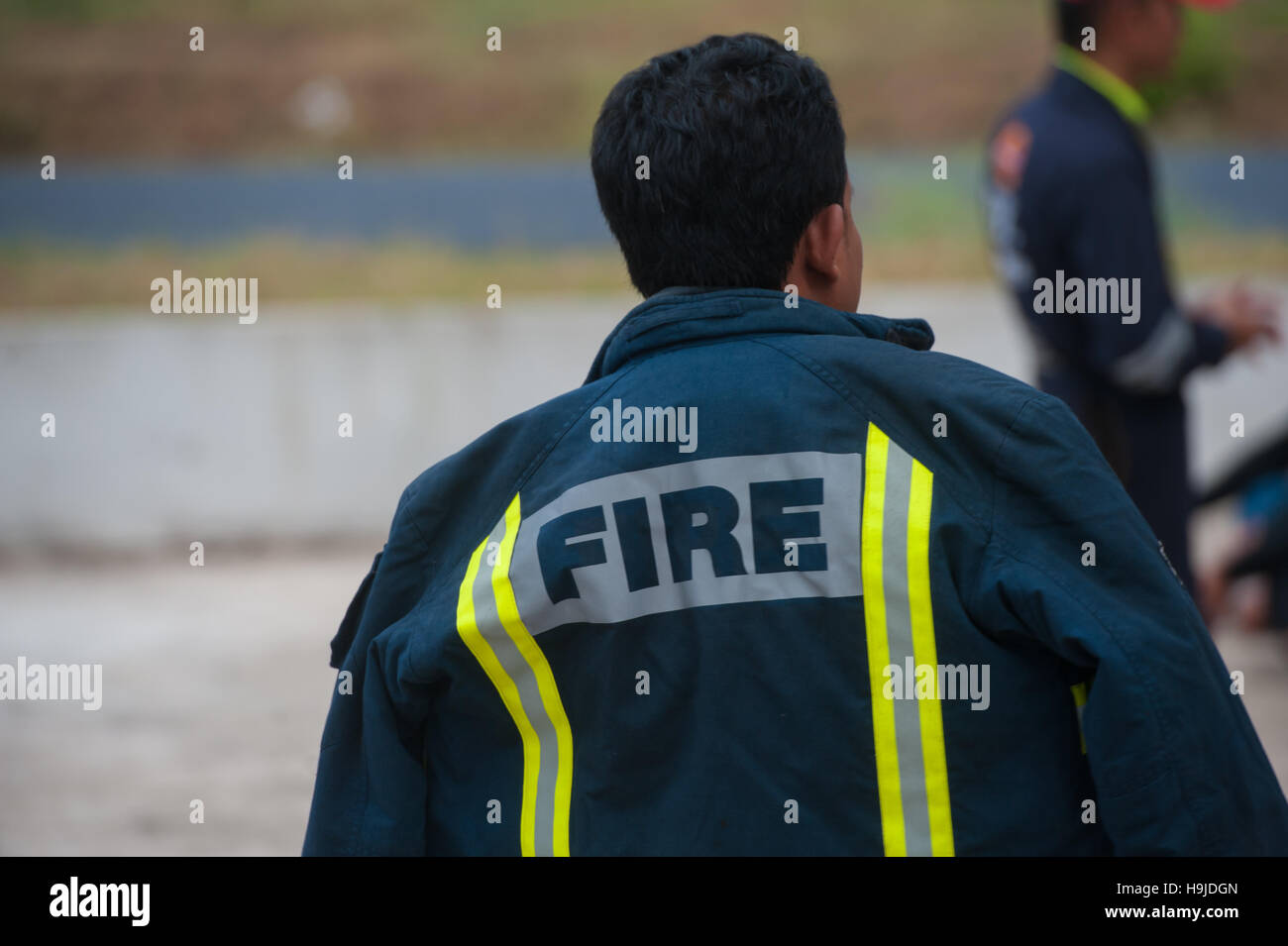 A firefighters dress their suit before the operating Stock Photo - Alamy