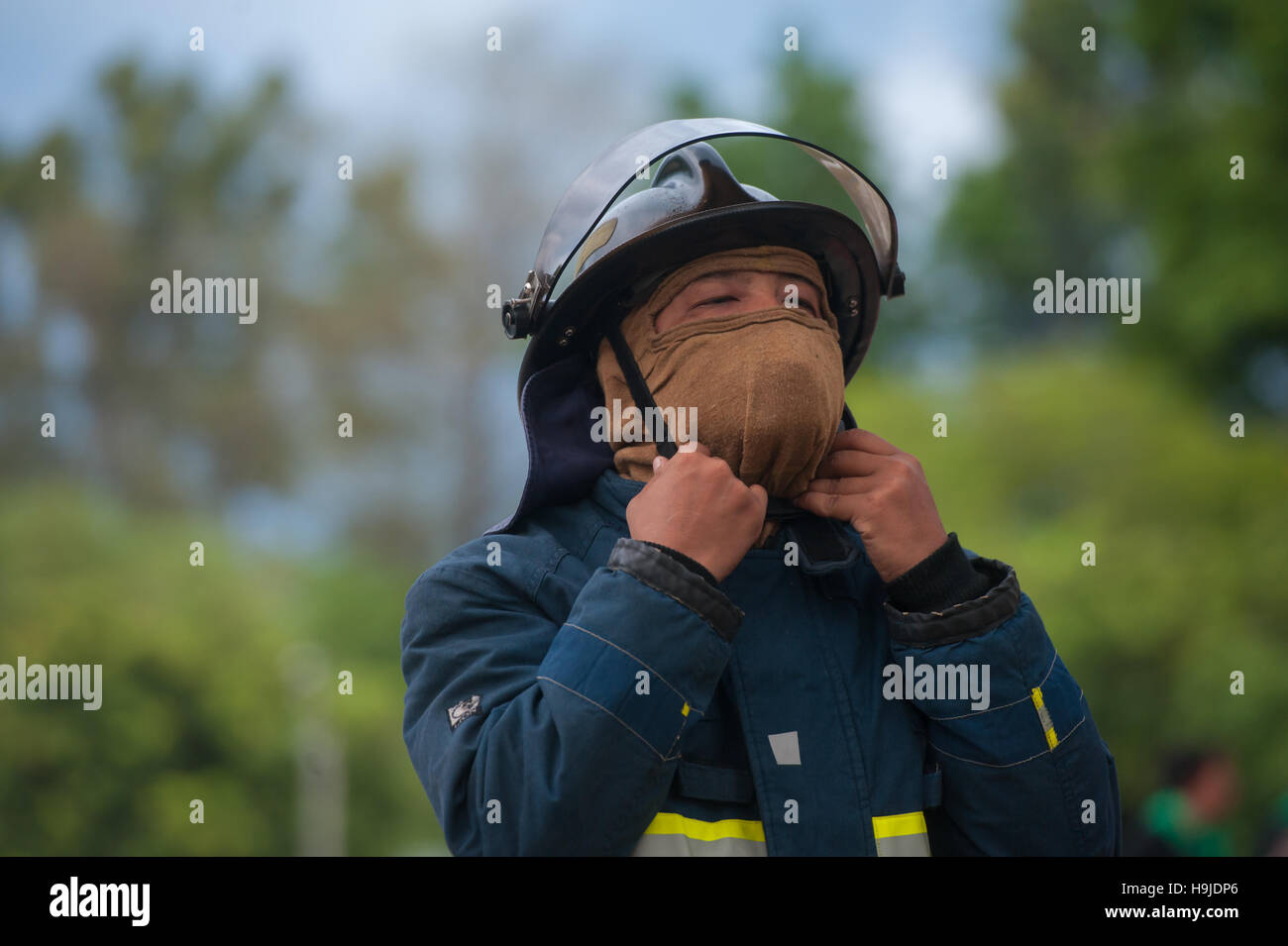 A firefighters dress their suit before the operating Stock Photo - Alamy