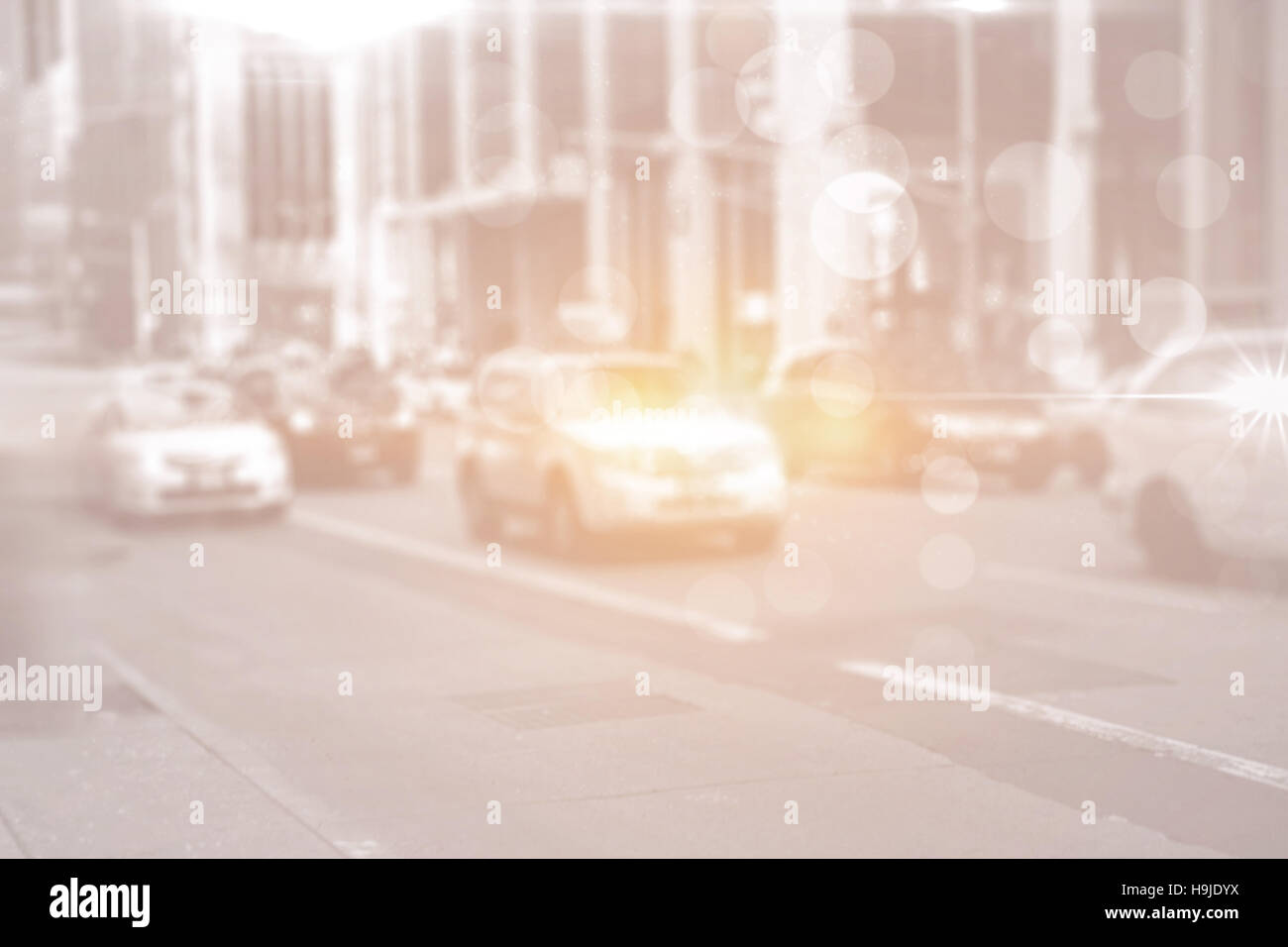 City street with cars and bright light and lensflares Stock Photo - Alamy
