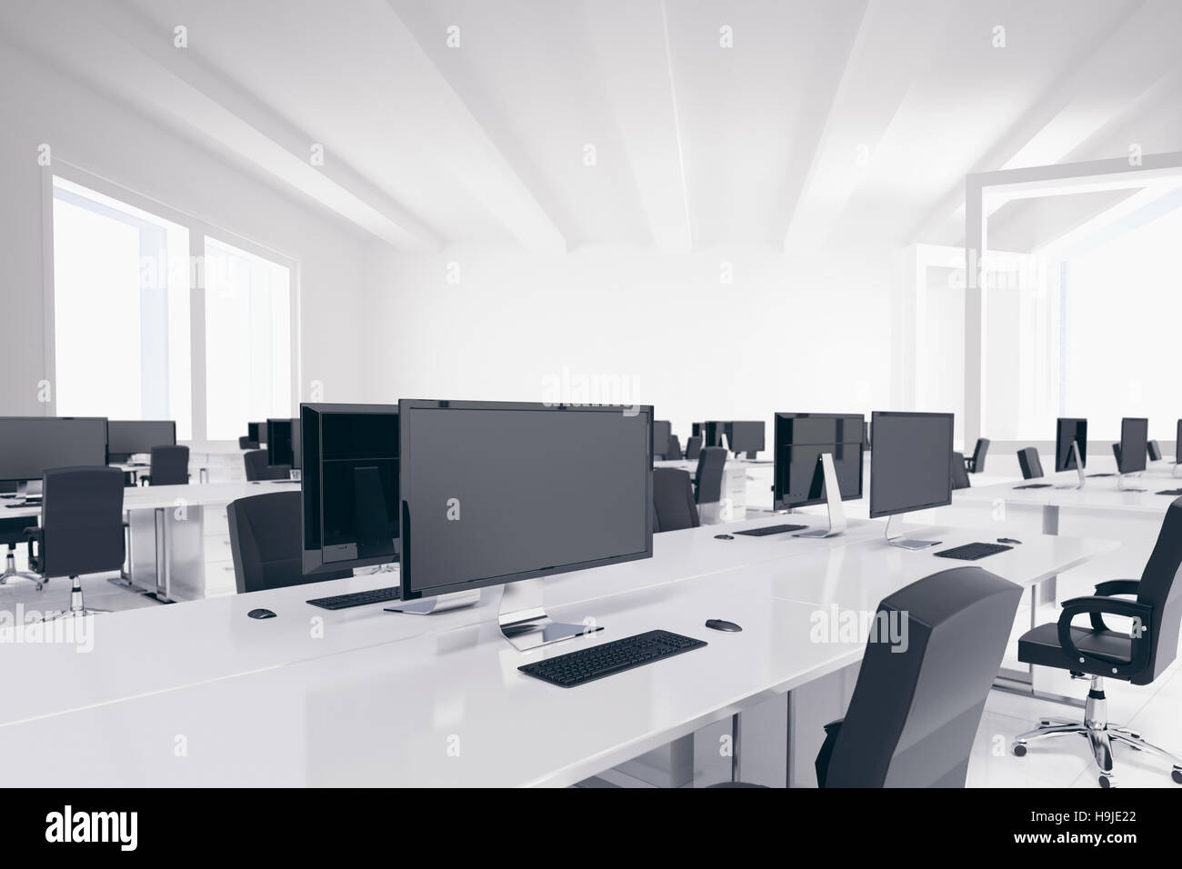 Empty office with desks and computers Stock Photo - Alamy