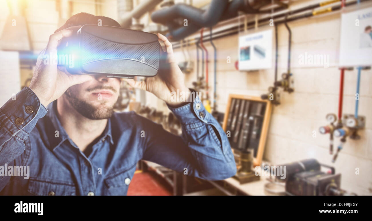 Composite image of man using an oculus Stock Photo - Alamy