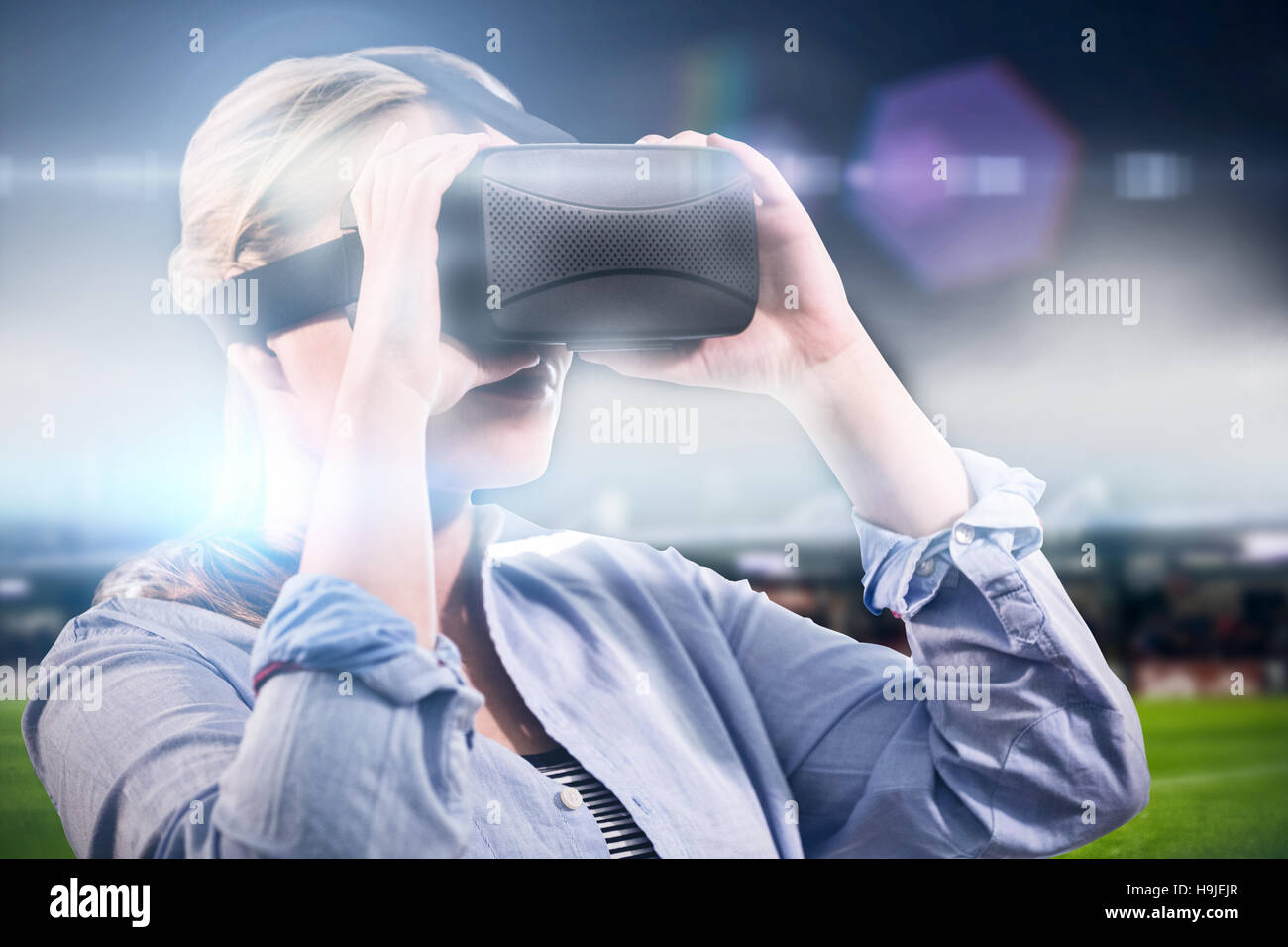 Composite image of woman using an oculus Stock Photo - Alamy