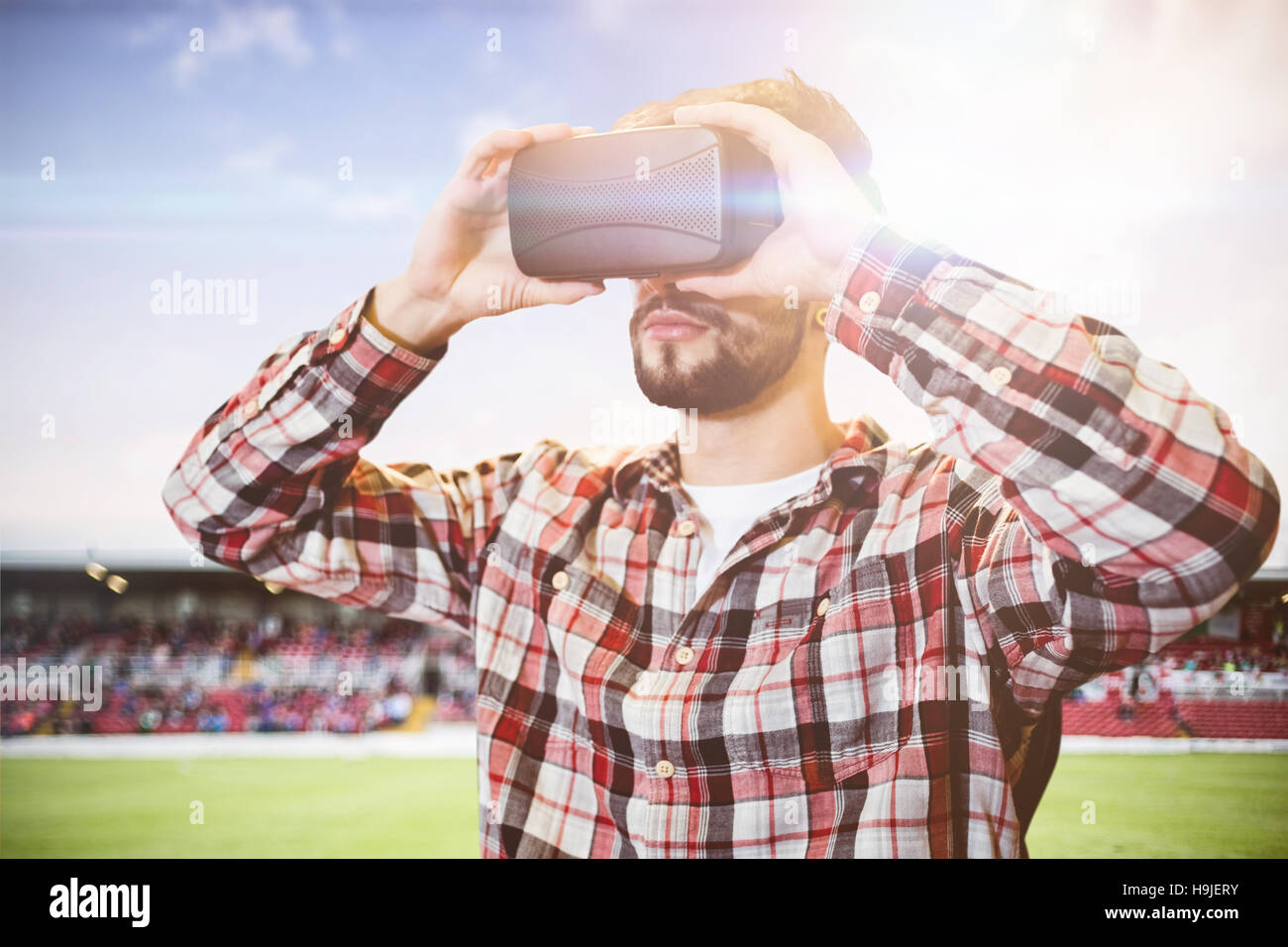 Composite image of man using an oculus Stock Photo - Alamy