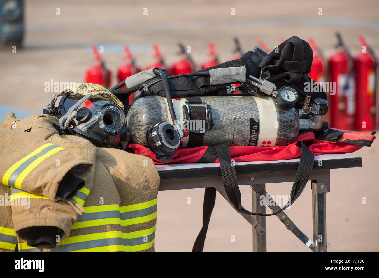 firefighter helmet and suit Stock Photo - Alamy