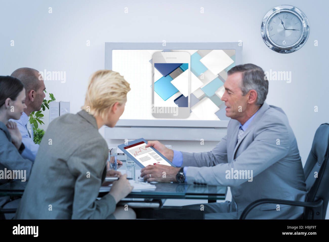 Composite image of colleagues speaking about work Stock Photo - Alamy