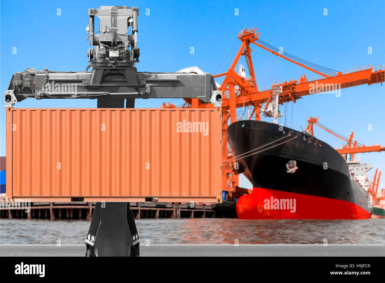 Crane lifting up container to commercial delivery cargo container truck ...