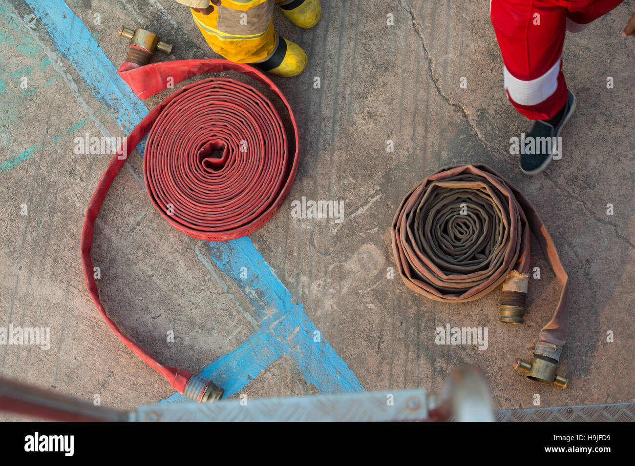 Water hose connected to hydrant during firefighting operation Stock ...