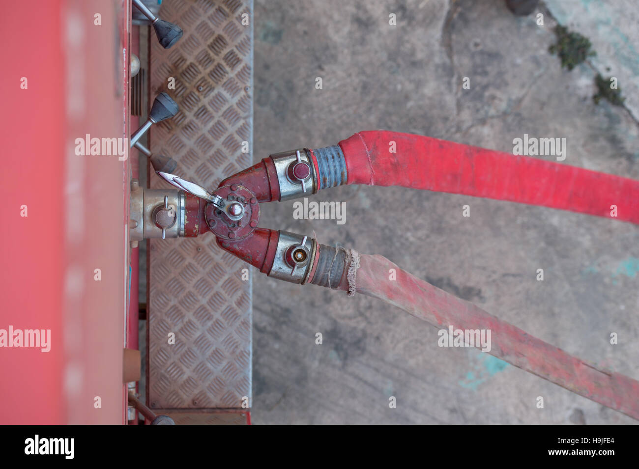 Water hose connected to hydrant during firefighting operation Stock ...