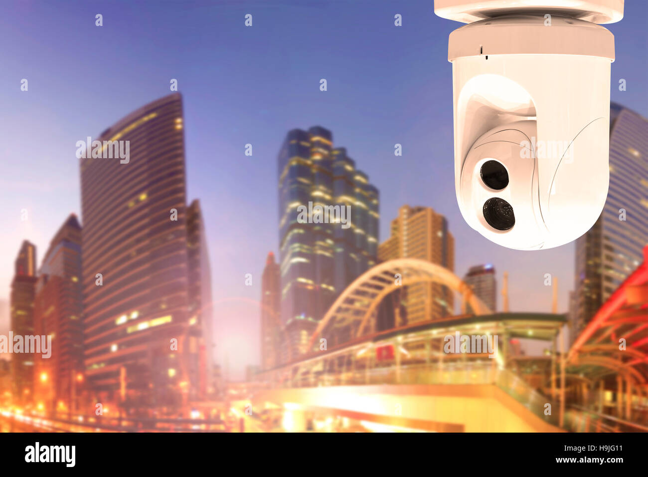 Security Camera or surveillance Operating on urban scene in sunset ...