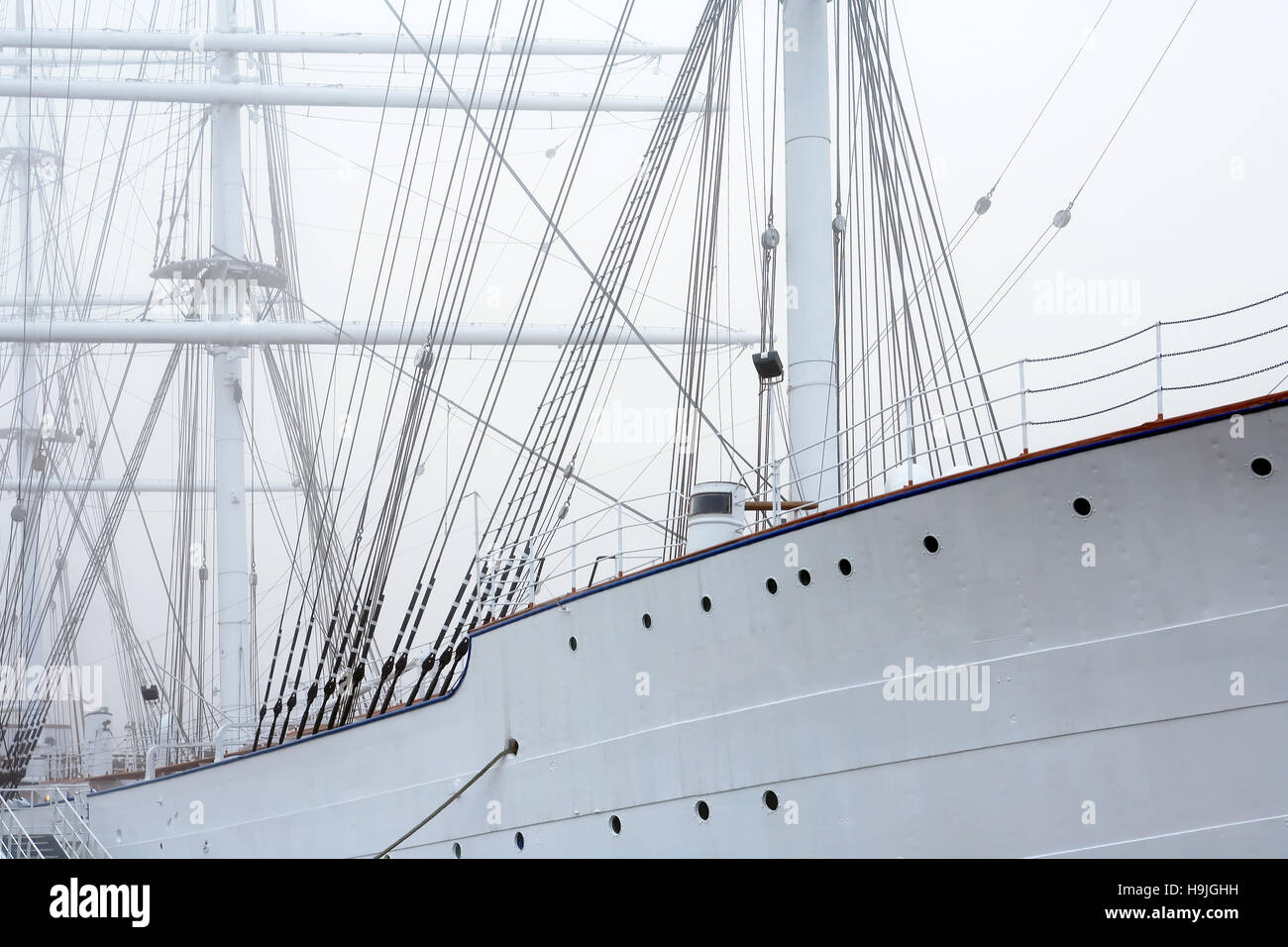 Big white sailing ship closeup in morning fog Stock Photo - Alamy