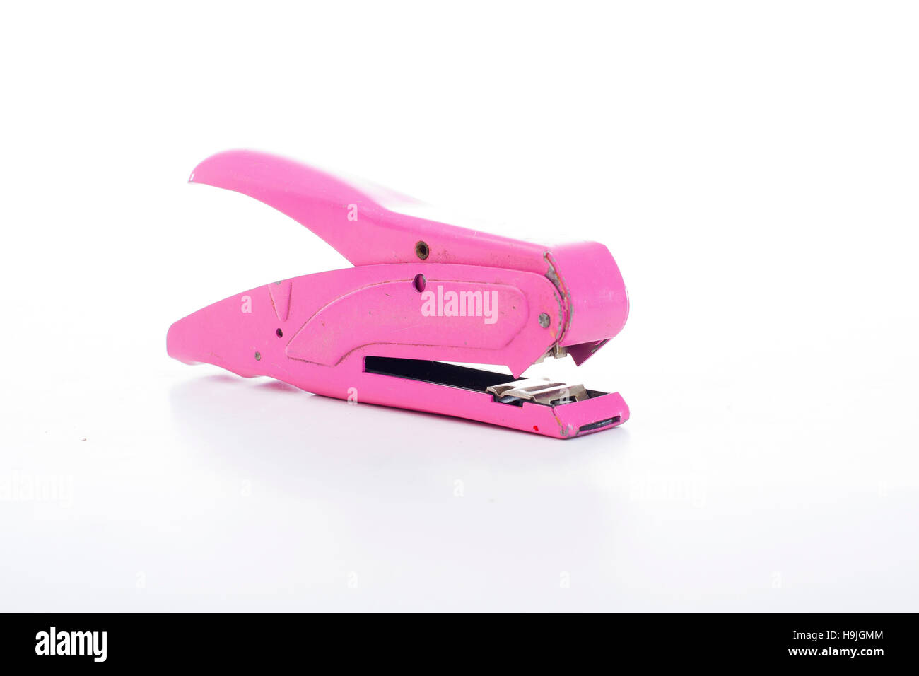 Pink stapler business tool. Stapler can illustrate any business concept ...