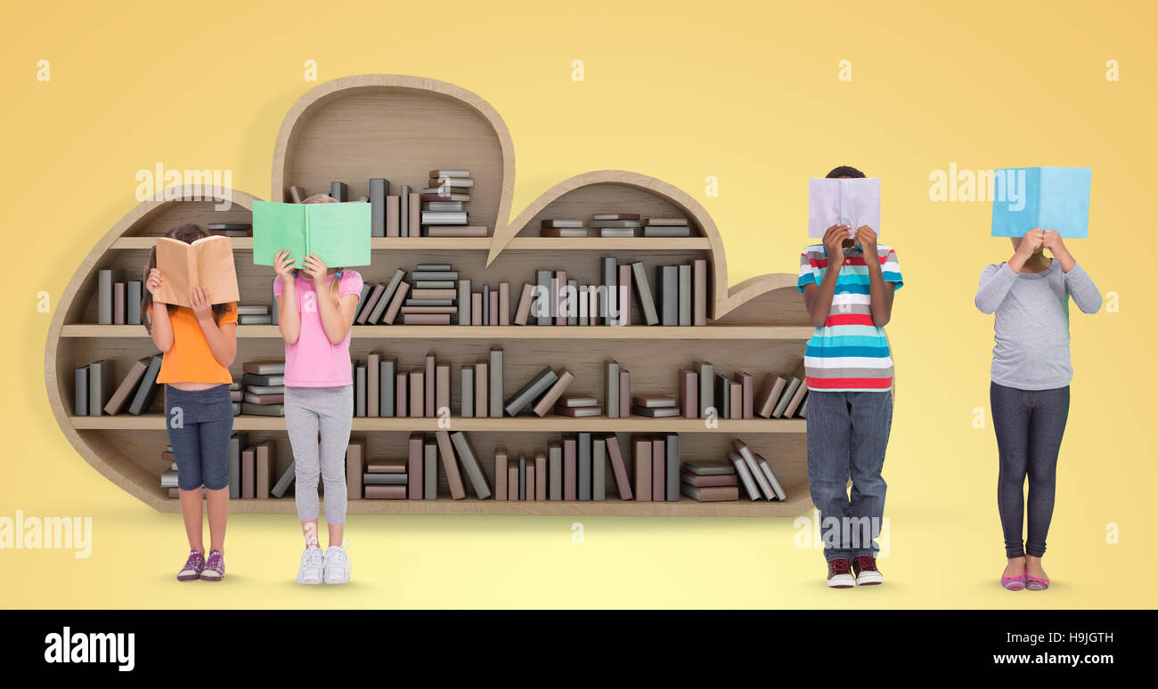 Composite image of elementary pupils reading Stock Photo - Alamy