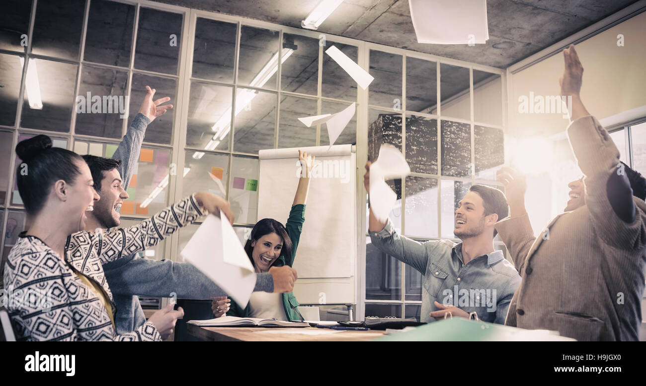 Celebrating business people throwing papers in the air Stock Photo - Alamy