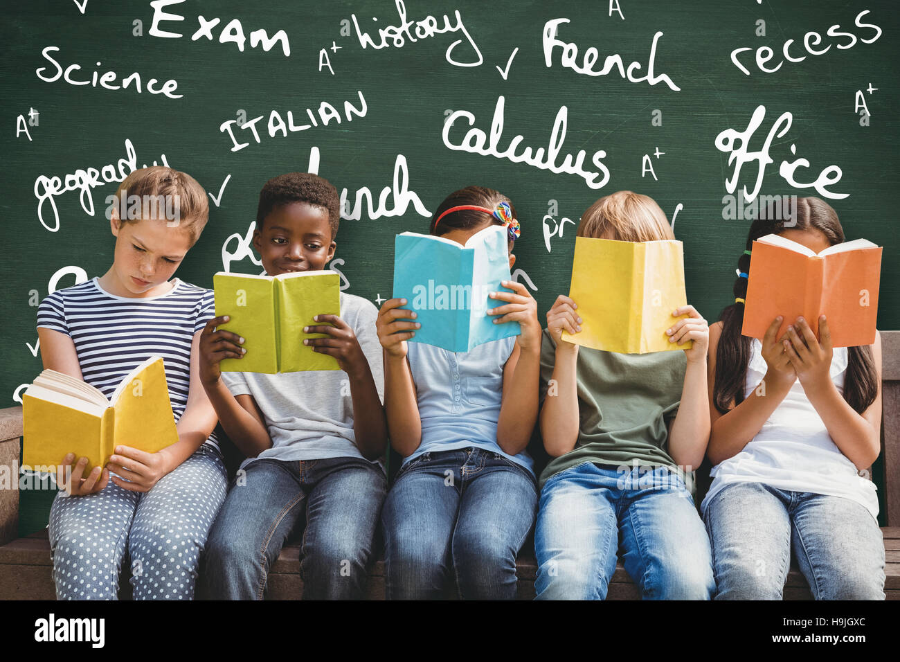 Composite image of children reading books at park Stock Photo - Alamy
