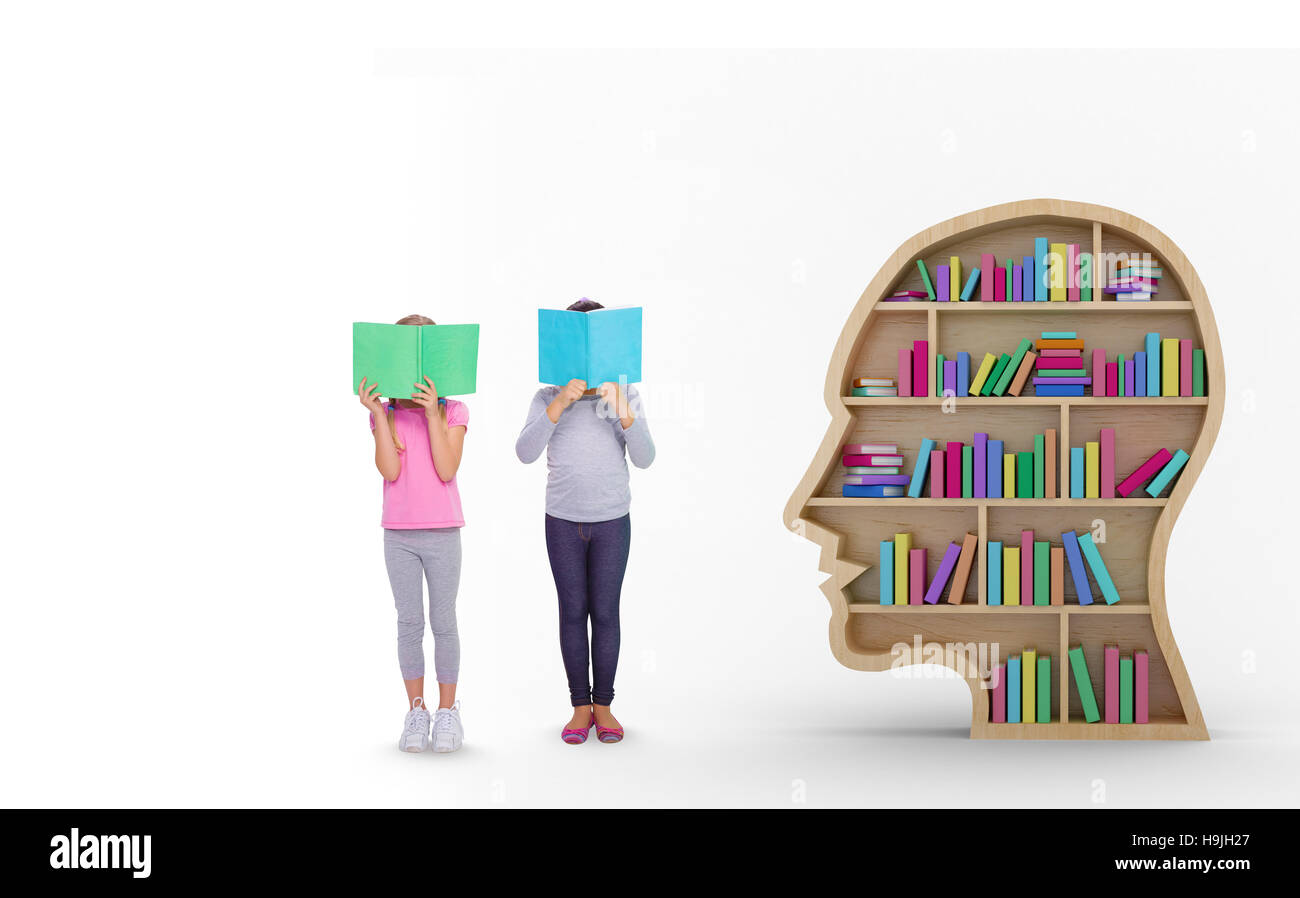 Composite image of elementary pupils reading Stock Photo - Alamy