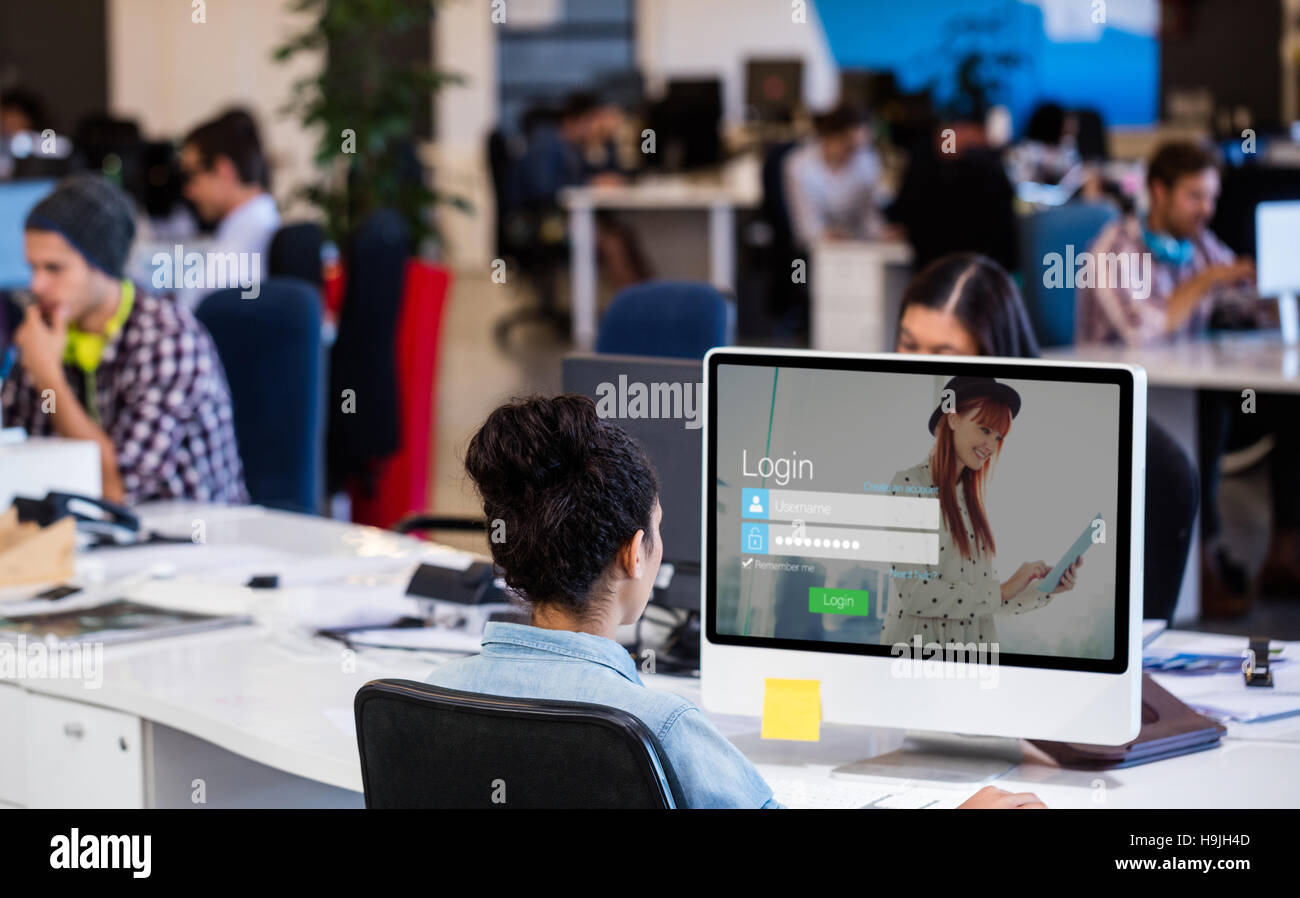 Composite image of login screen with redheaded woman and pad Stock ...