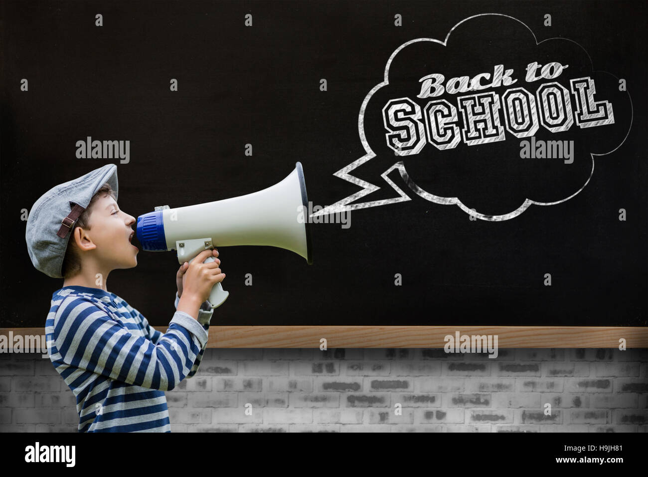 Composite image of boy speaking on megaphone Stock Photo - Alamy