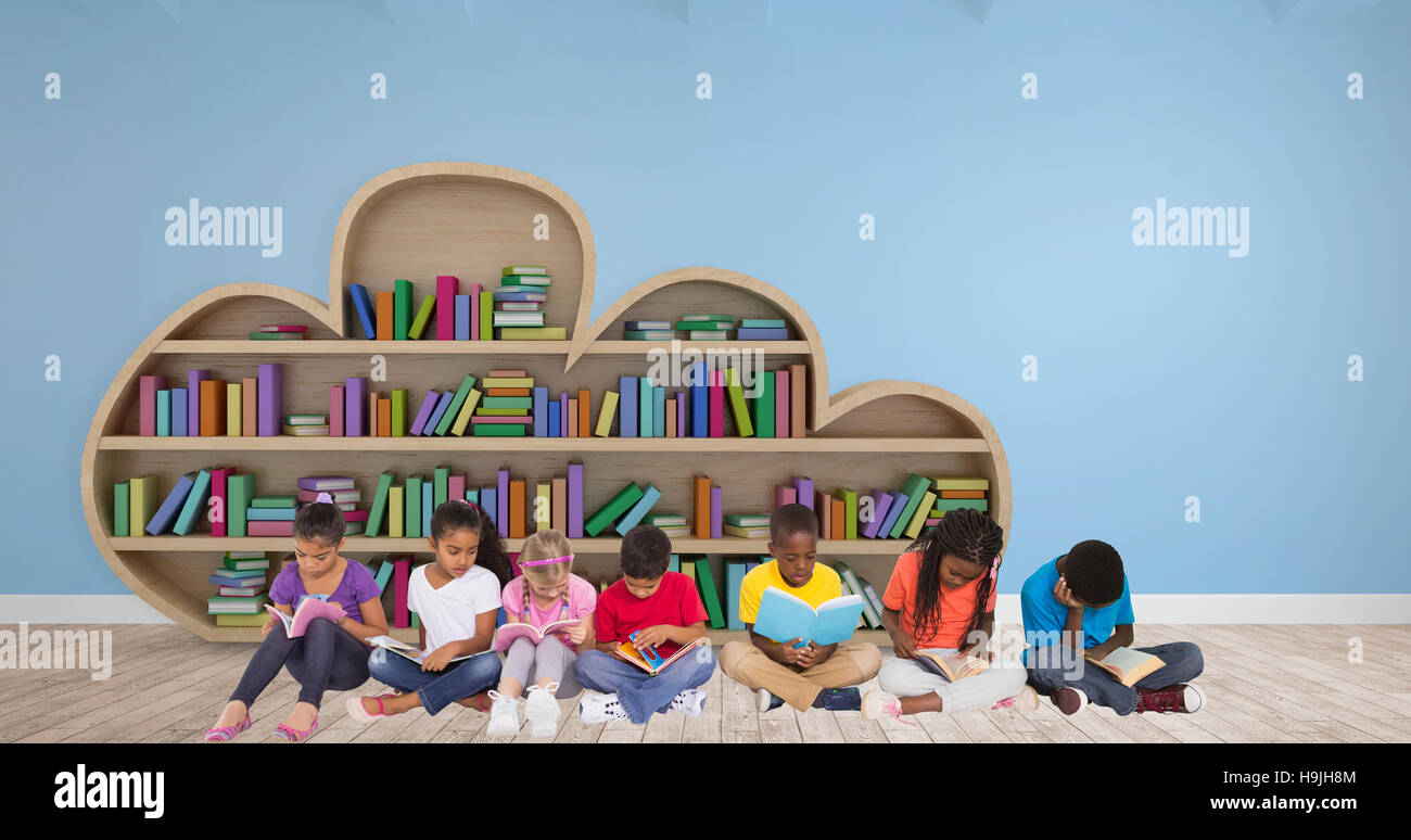 Composite image of elementary pupils reading books Stock Photo - Alamy