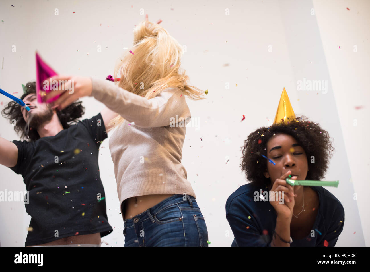 confetti party happy young people group celebrating new year eve while ...