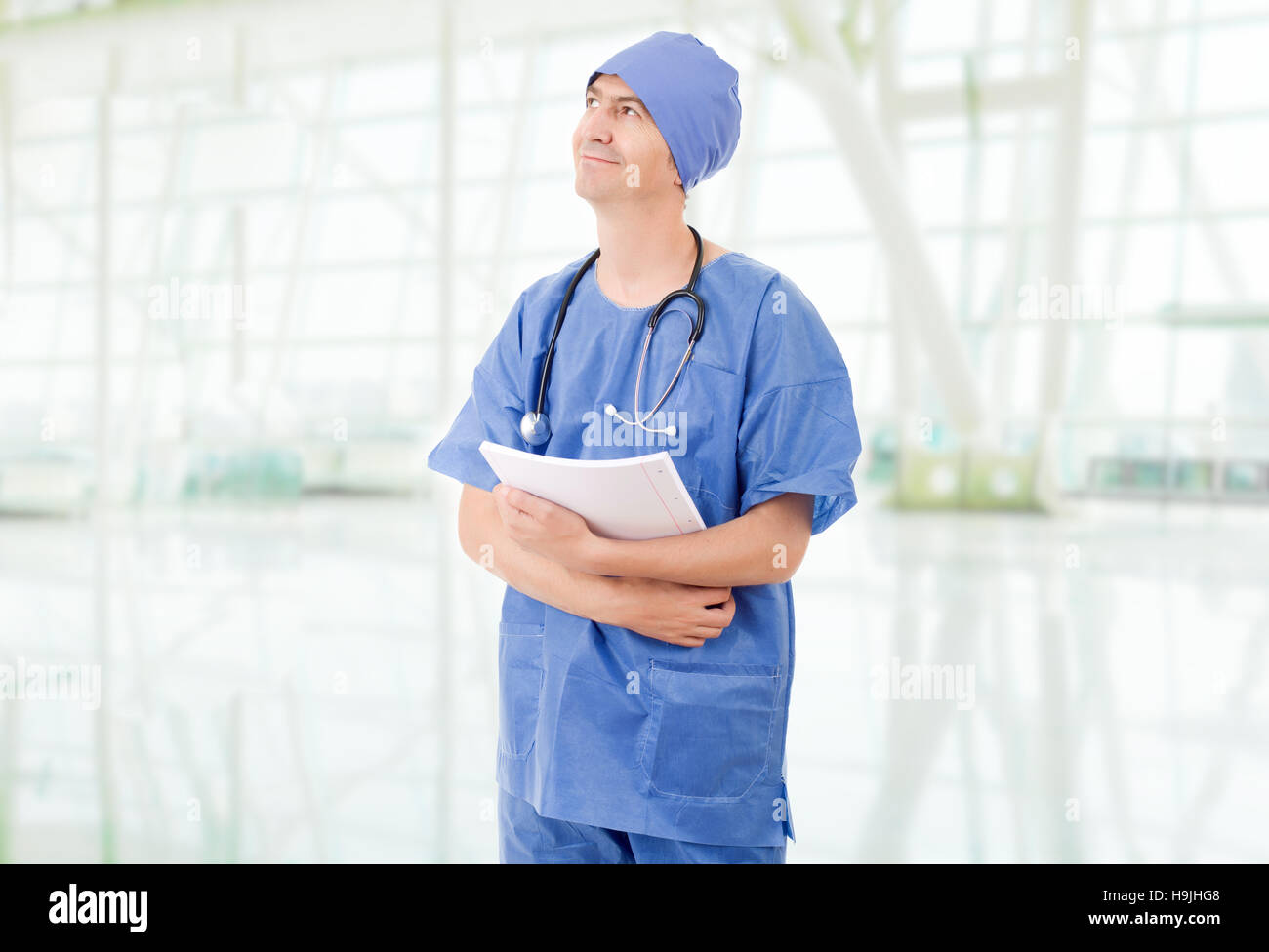 male doctor thinking at the hospital Stock Photo - Alamy