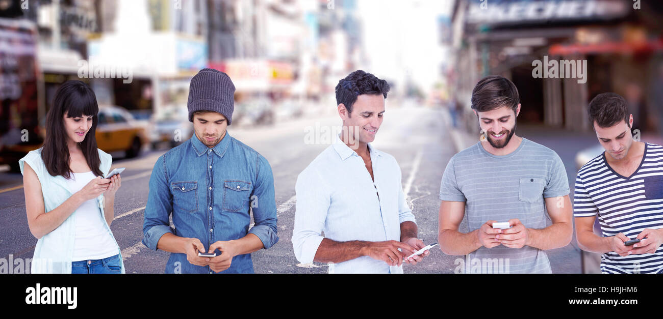 Composite image of handsome man text messaging through smart phone ...