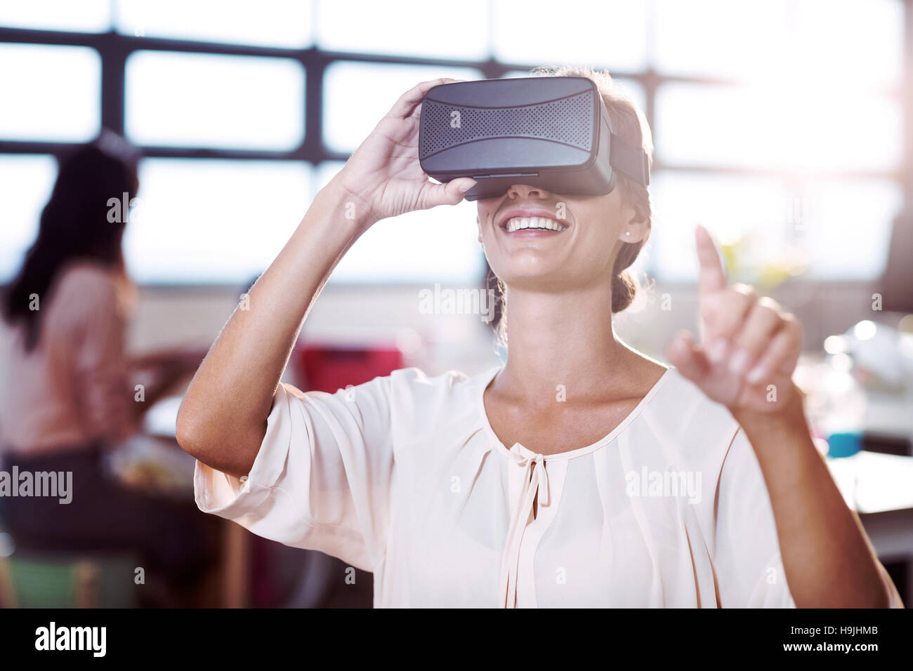 Female graphic designer using the virtual reality headset Stock Photo ...