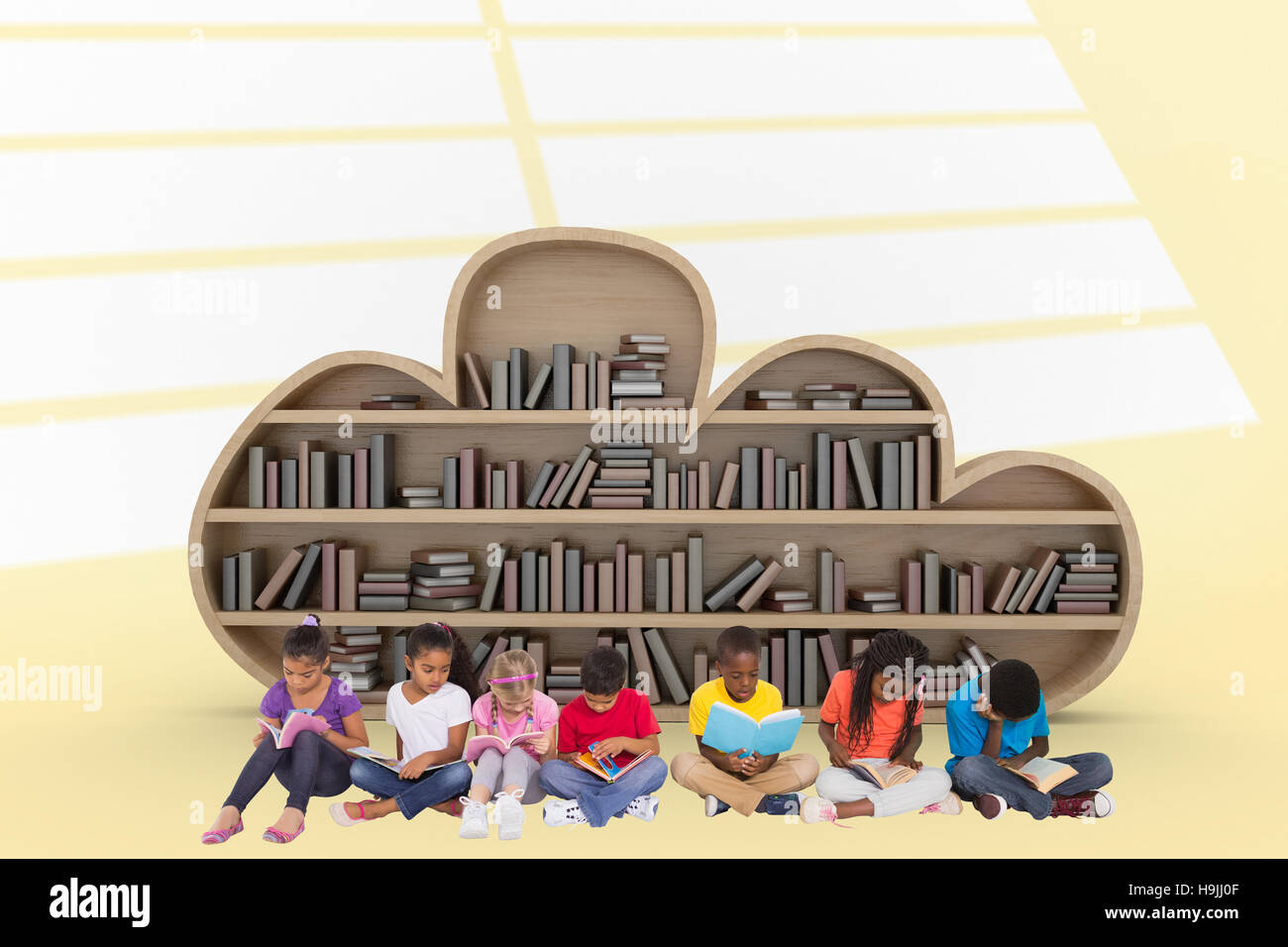 Composite image of elementary pupils reading books Stock Photo - Alamy