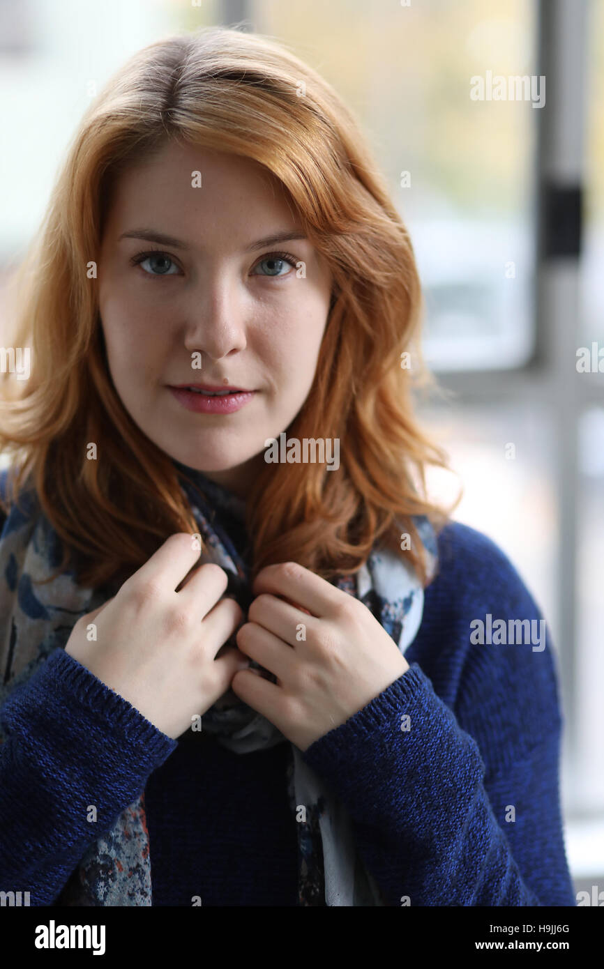 Head shot of a very attractive young woman with red hair and stunning ...