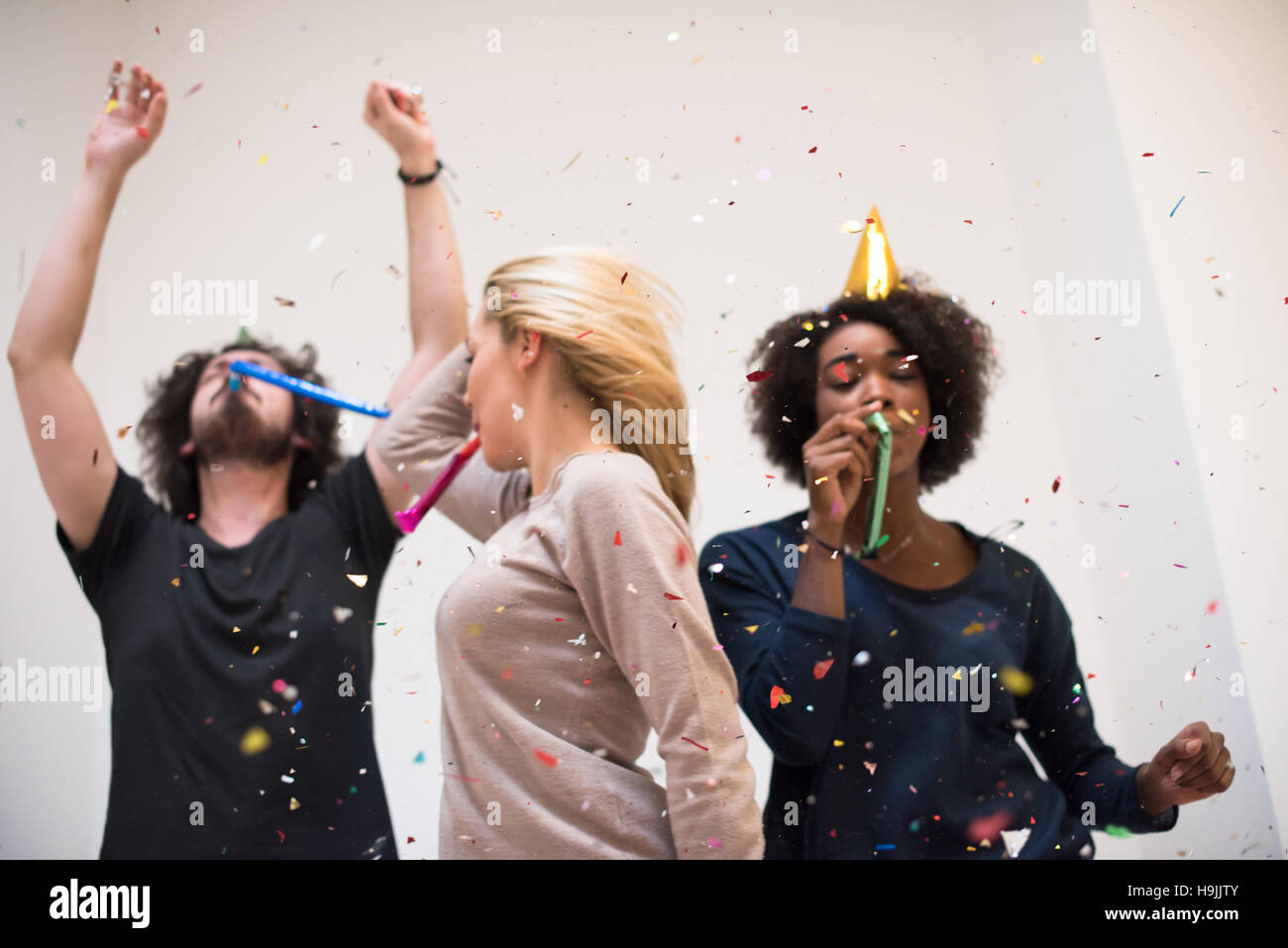 confetti party happy young people group celebrating new year eve while ...