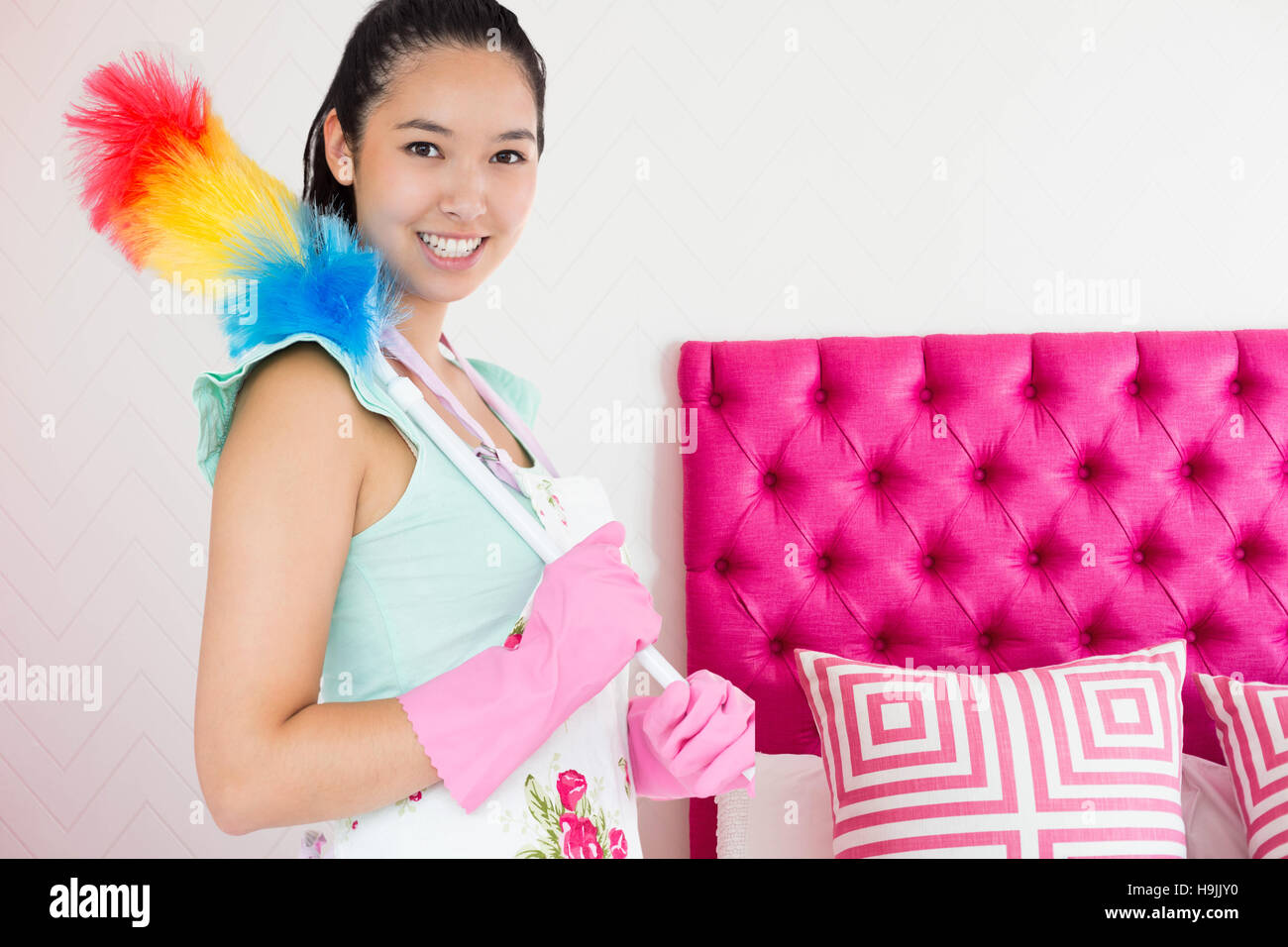 Woman feather duster cleaning hi-res stock photography and images - Alamy