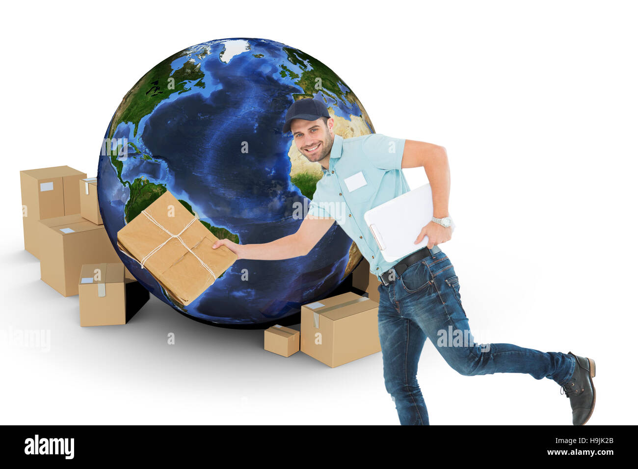 Delivery man smiling holding Cut Out Stock Images & Pictures - Alamy