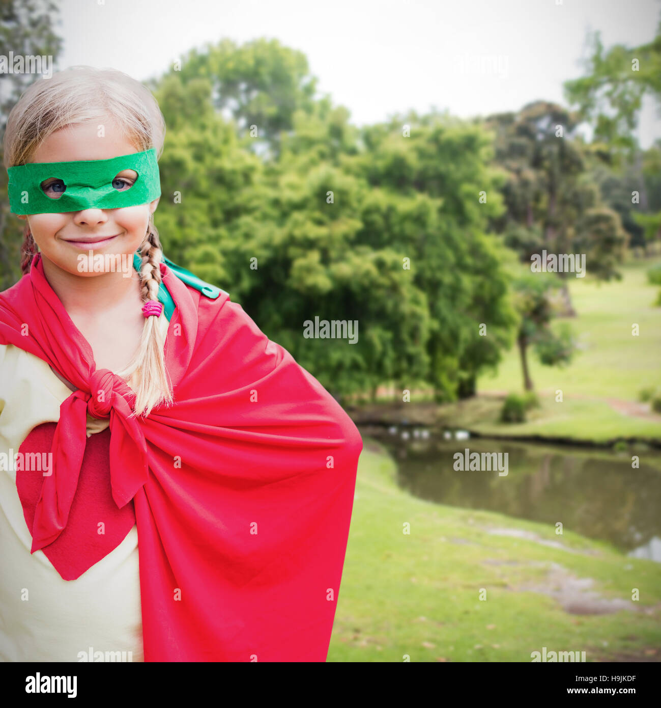 Composite image of portrait of cute girl in red cape Stock Photo - Alamy