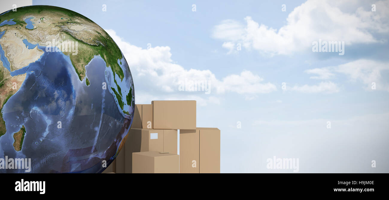 Composite image of earth surrounded by cardboard boxes Stock Photo - Alamy