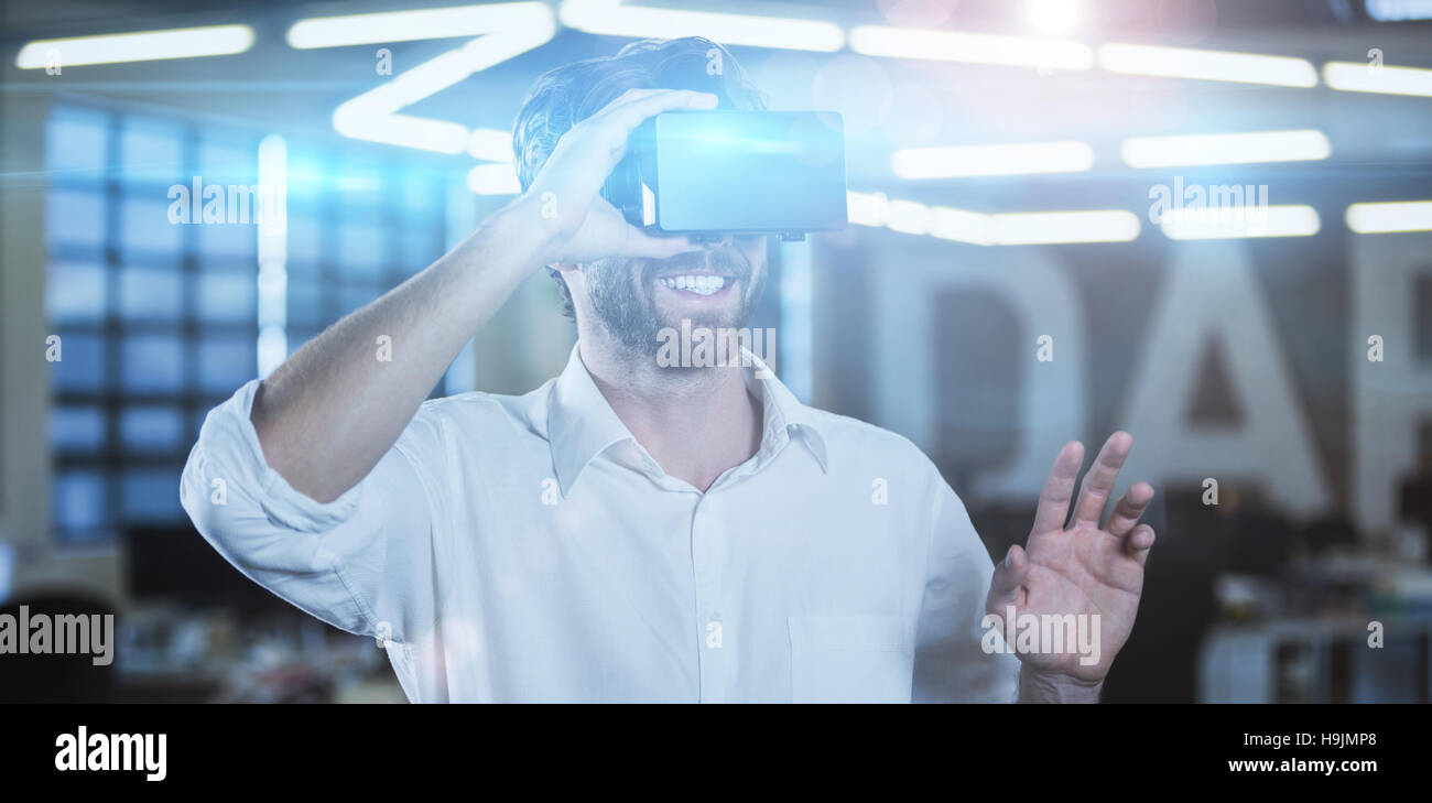 Businessman wearing virtual reality simulator Stock Photo - Alamy