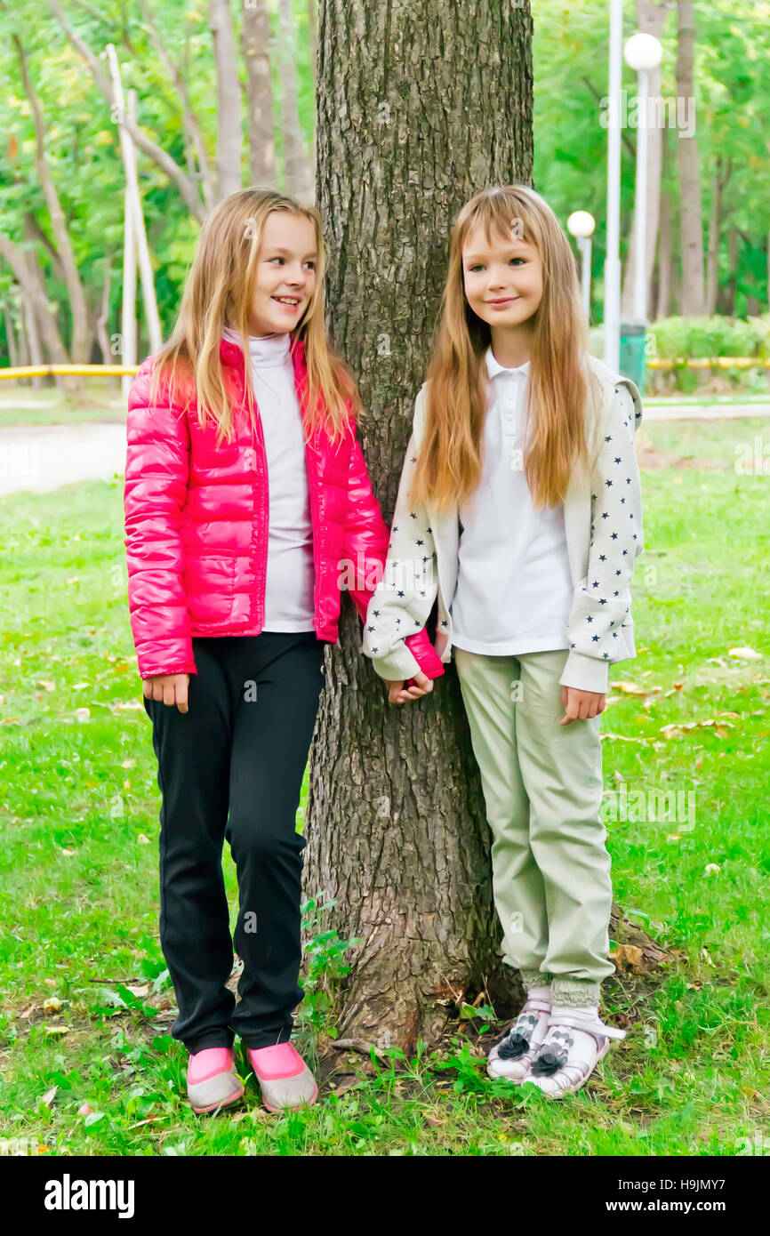 Photo of two cute girls with long hairs Stock Photo - Alamy