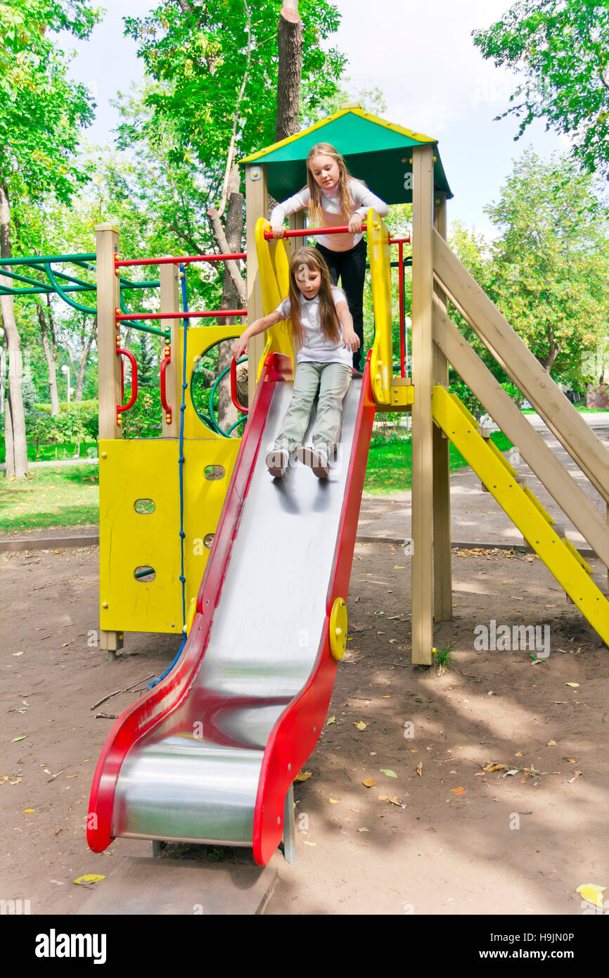 Photo of two active girls on nursery platform Stock Photo - Alamy
