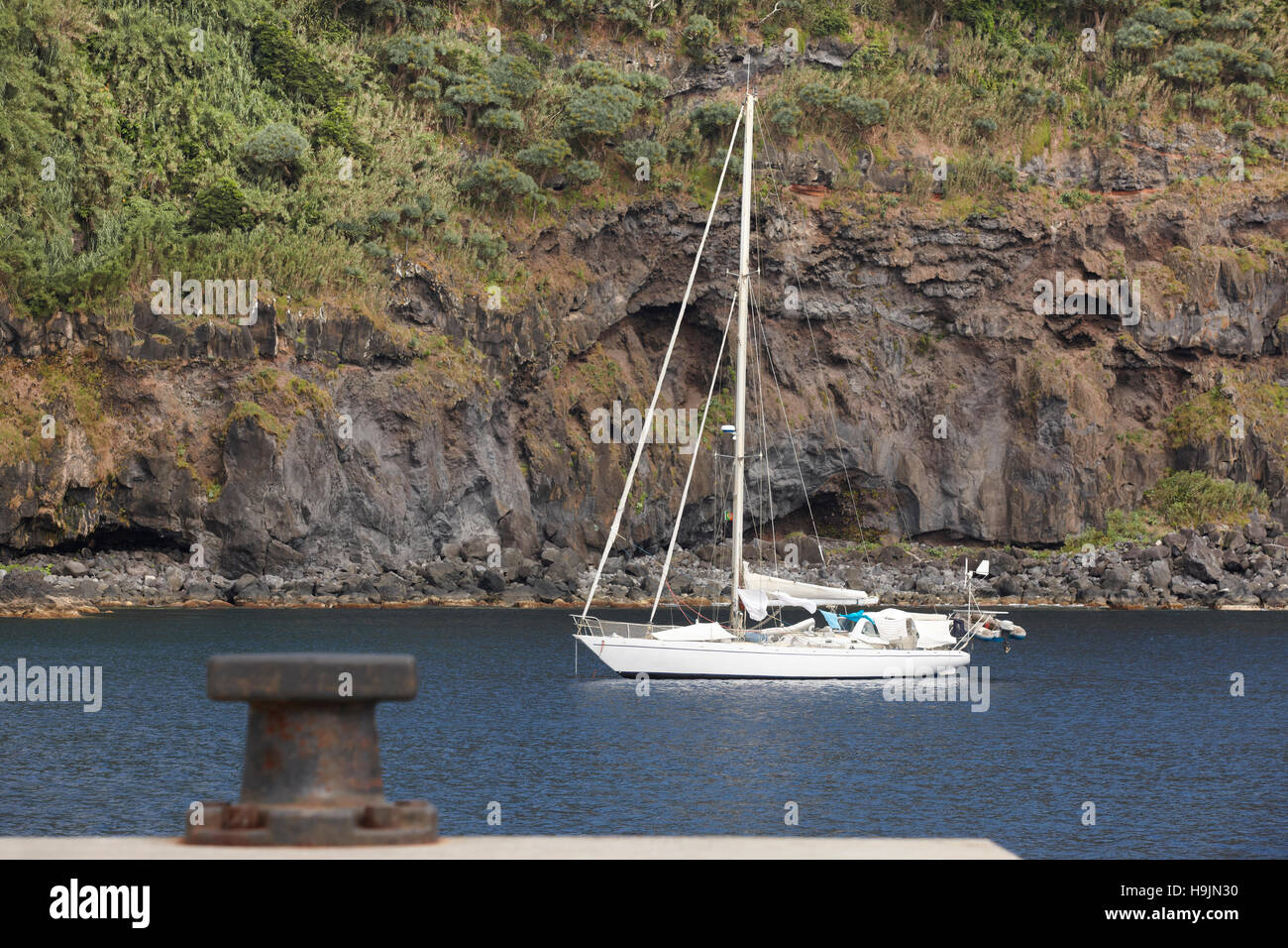 Anchored sailboat in Flores island port entrance. Azores, Portugal ...