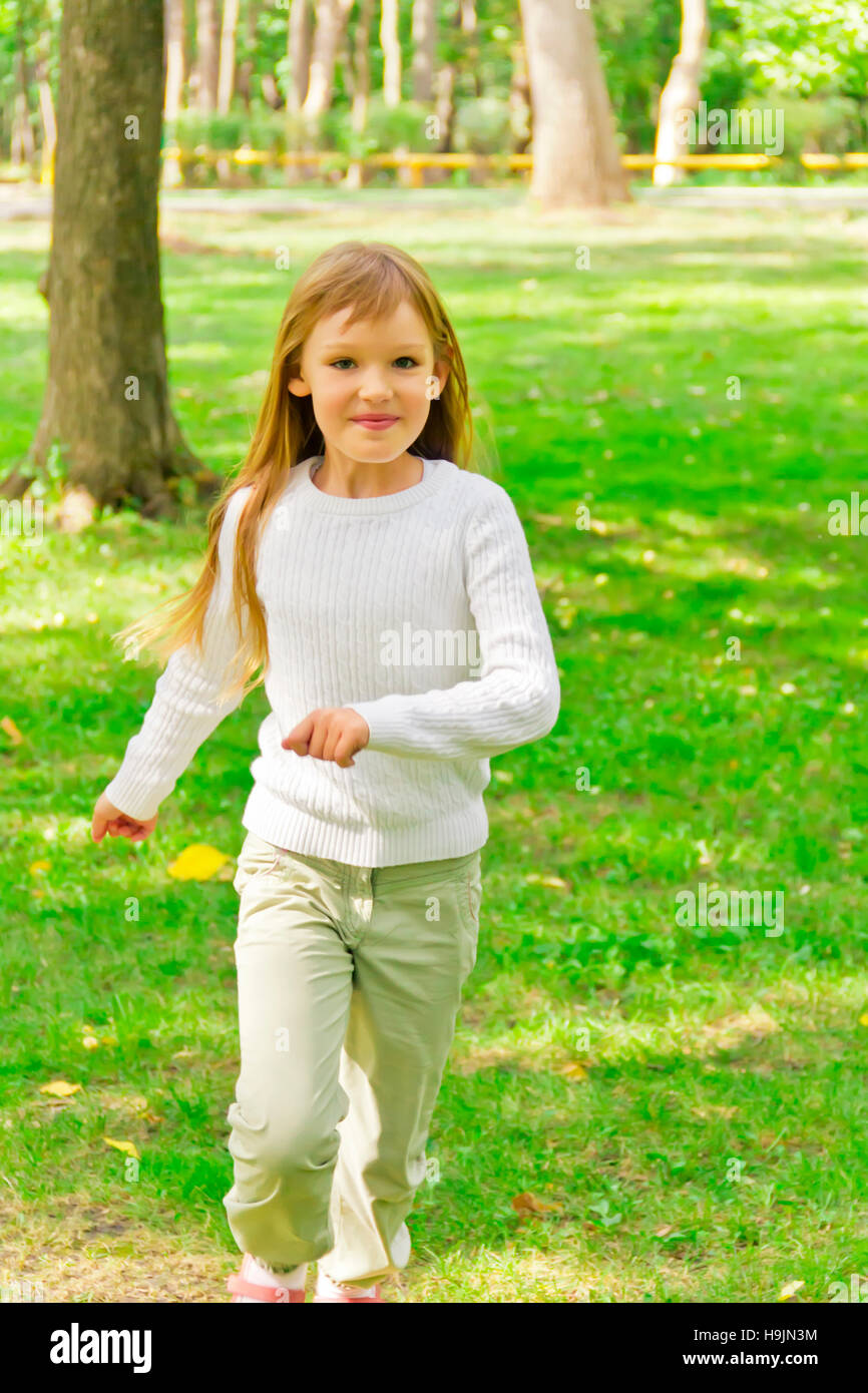 Photo of cute running girl in summer Stock Photo - Alamy