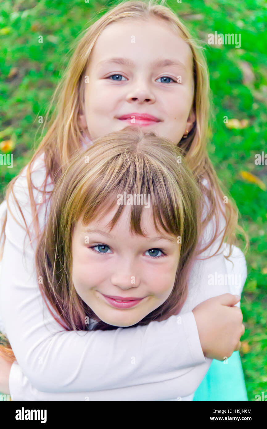 Photo of two cute girls with long hairs Stock Photo - Alamy