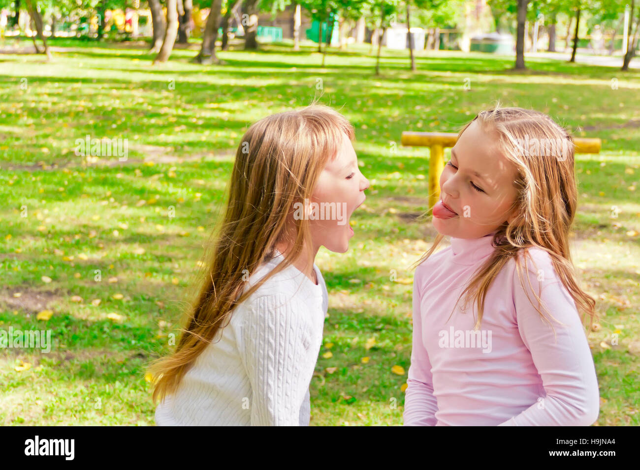 Photo of two playing girls in summer Stock Photo - Alamy