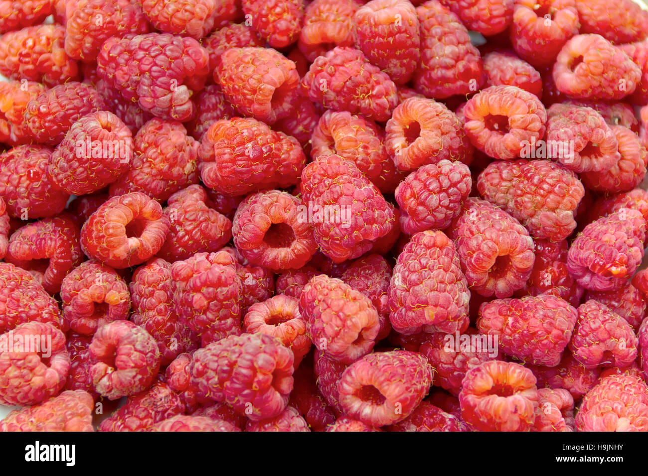Photo of the background fresh red raspberry Stock Photo - Alamy