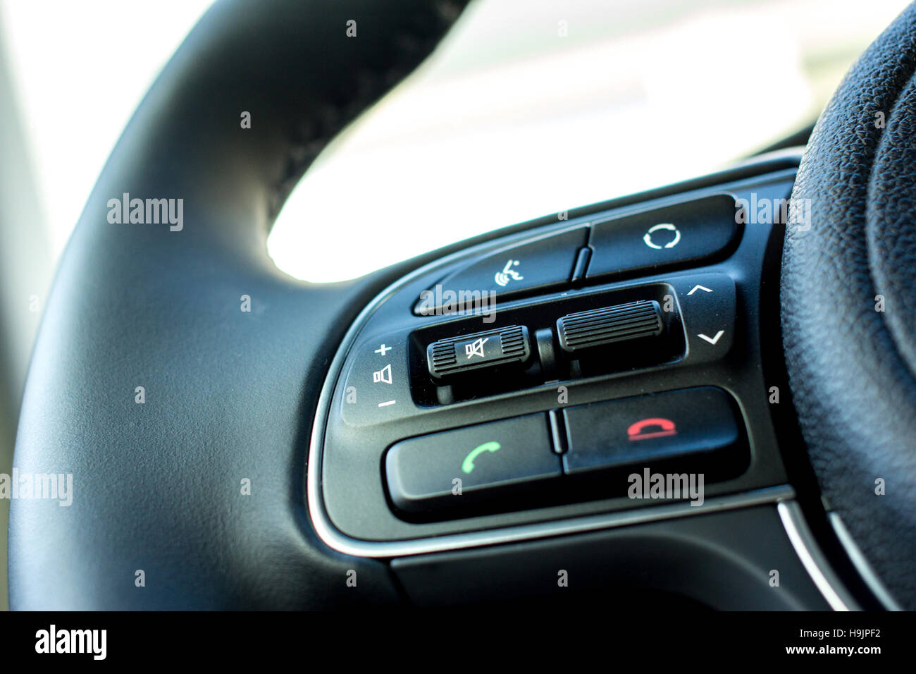 Car audio control buttons on steering wheel Stock Photo - Alamy