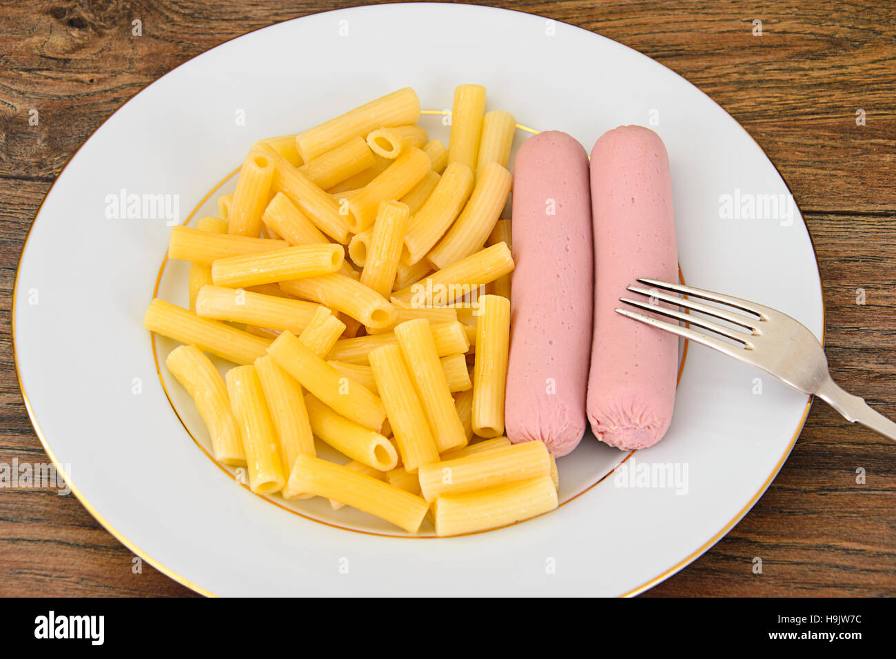 Eating Fast Food: Pasta with Sausage on Plate. Studio Photo Stock Photo ...