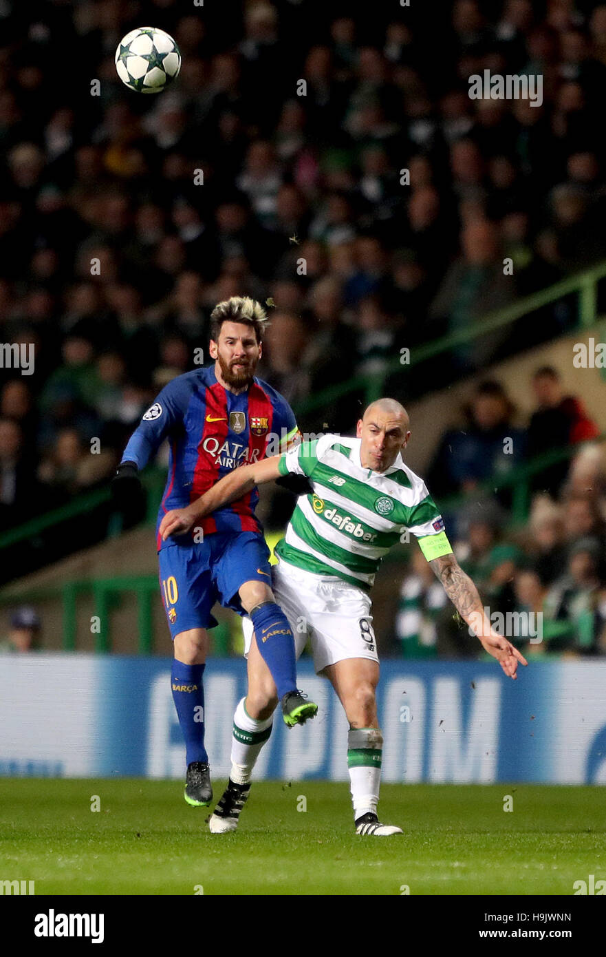 Barcelona's Lionel Messi (left) and Celtic's Scott Brown (right) battle ...