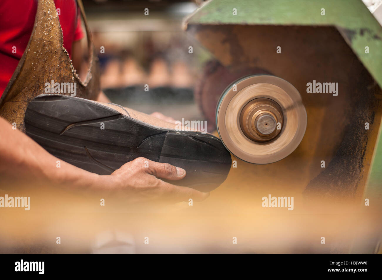Shoemaker working on shoe in workshop Stock Photo - Alamy