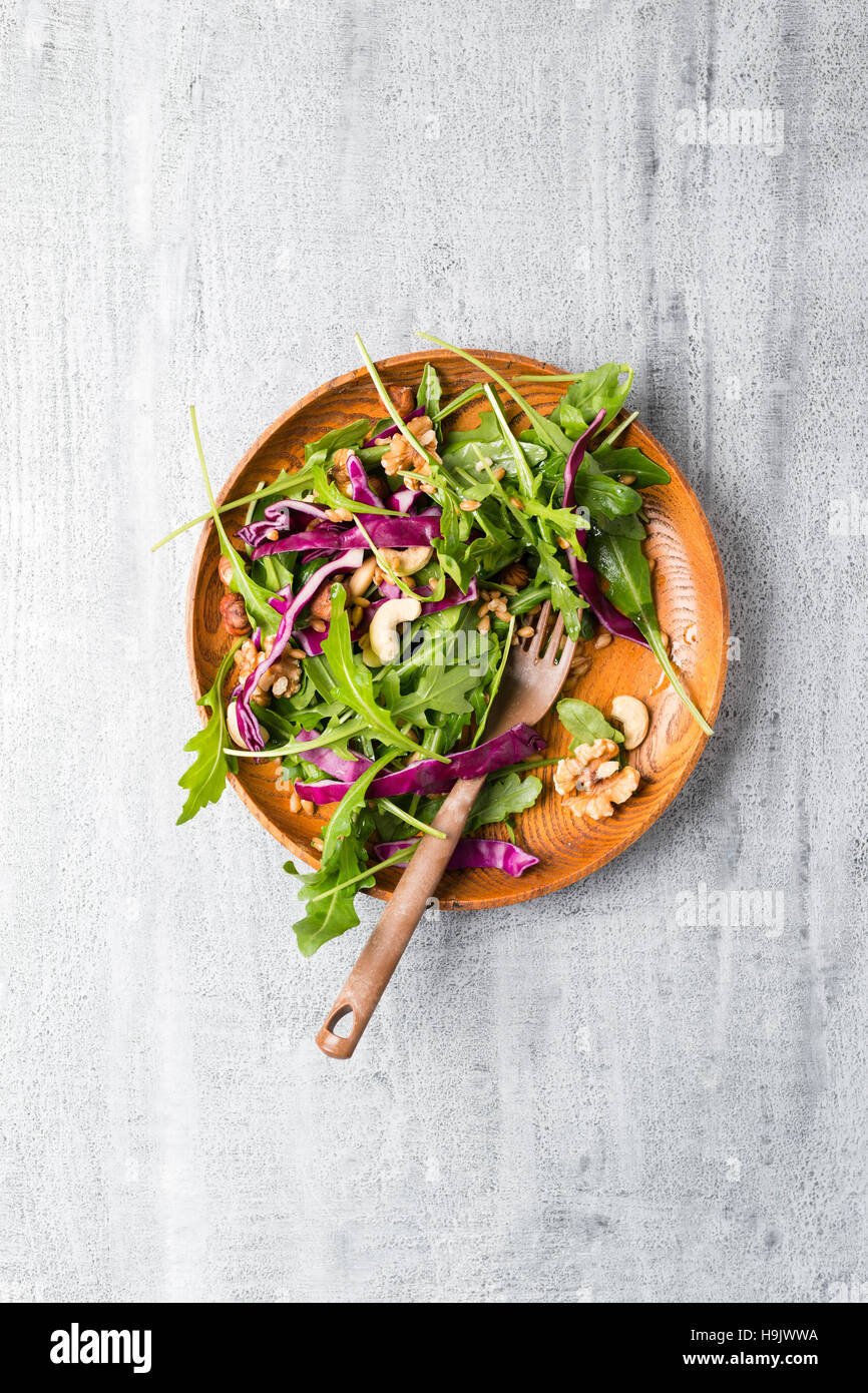 Salad with red cabbage, rocket, Einkorn wheat and various nuts on ...