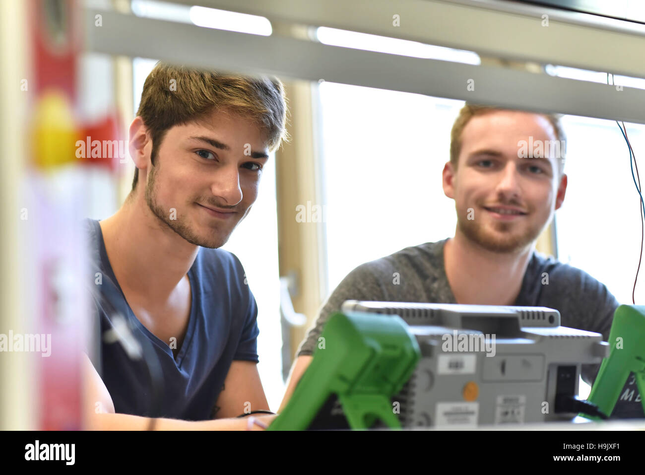 Portrait of smiling technical students Stock Photo - Alamy