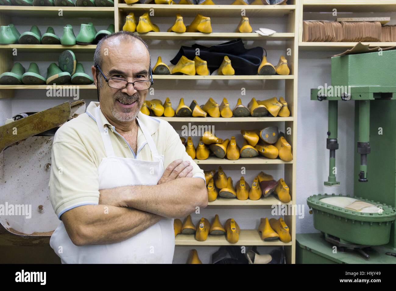 Portrait of a confident shoemaker in his workshop Stock Photo - Alamy