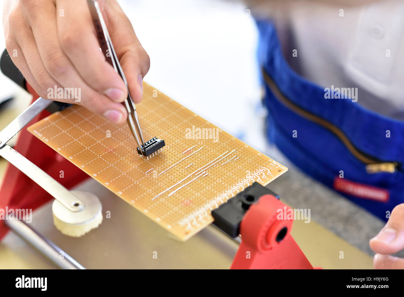 Assembling of a circuit board Stock Photo - Alamy