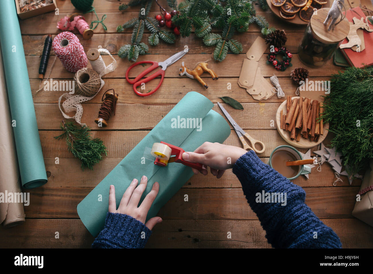 Woman's hands wrapping christmas gifts Stock Photo - Alamy